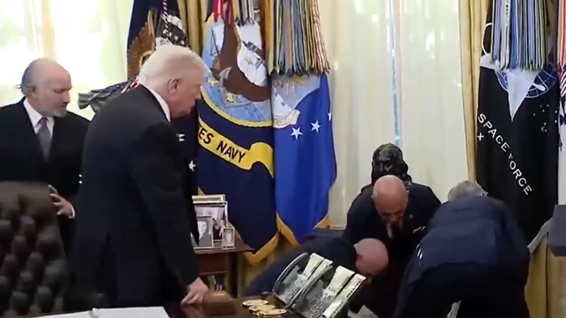 Man collapses behind Donald Trump during White House announcement