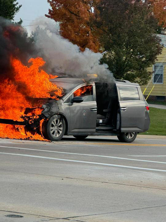 Ohio school van catches fire with people trapped inside