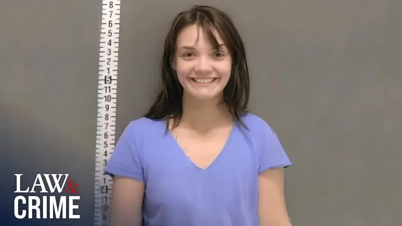 Woman smiles after chopping sleeping boyfriend in hatchet attack: cops