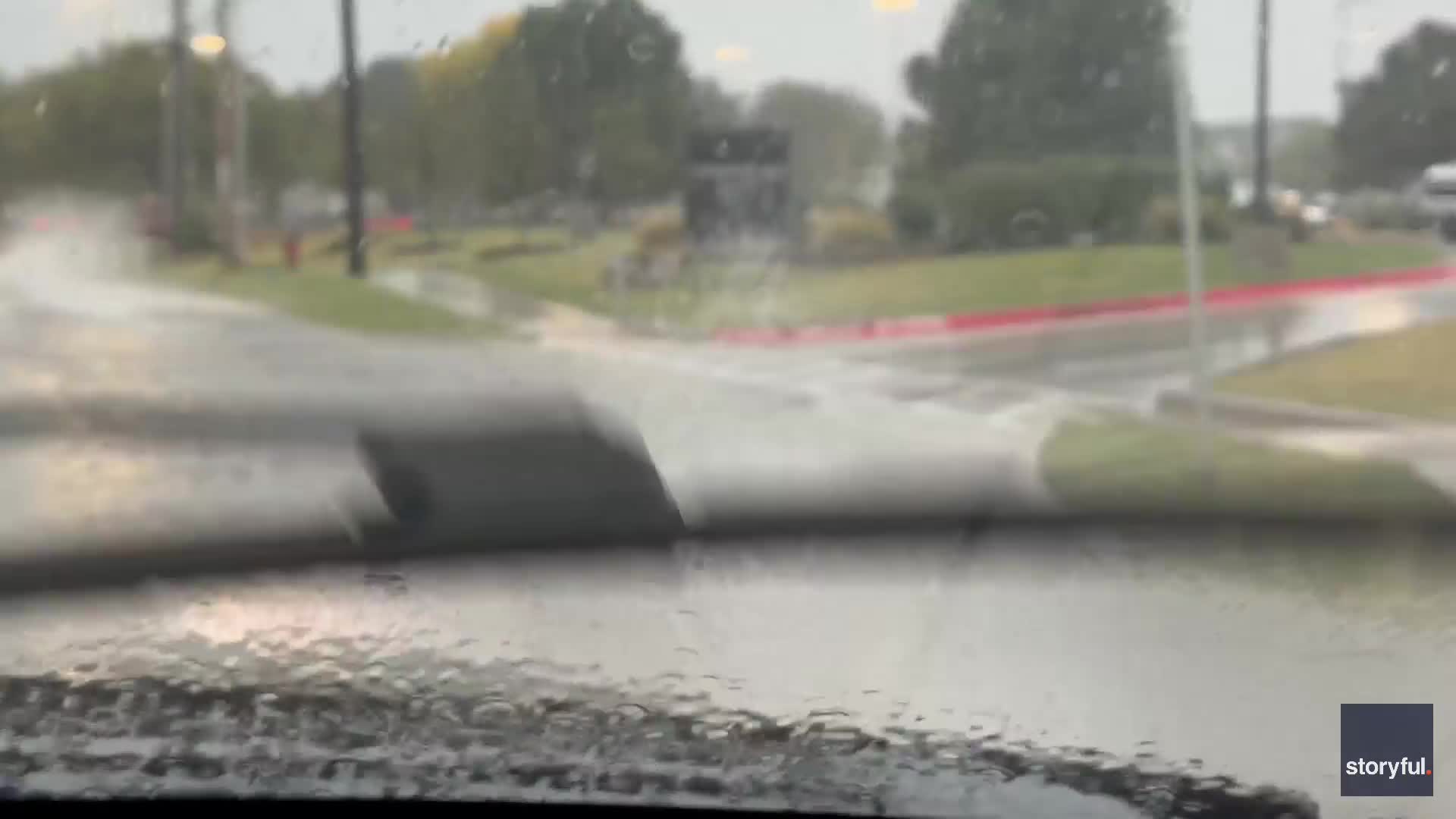 Cars Wade Through Flooded Abilene Roads