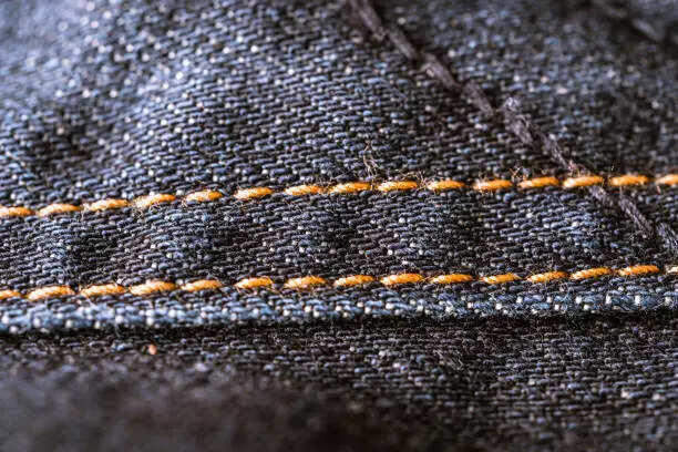 Why do most jeans have yellow stitching?