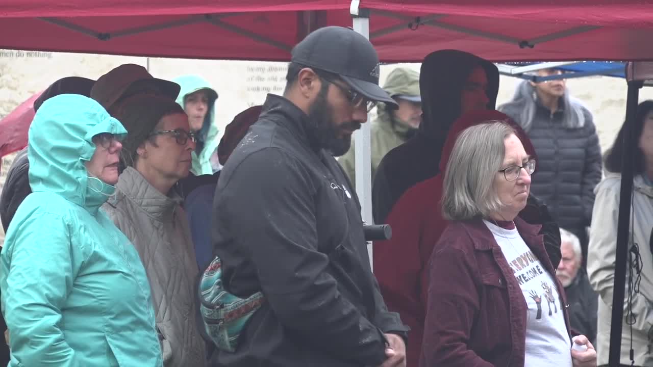 Faith leaders hold a vigil in the wake of the raid in Wilder