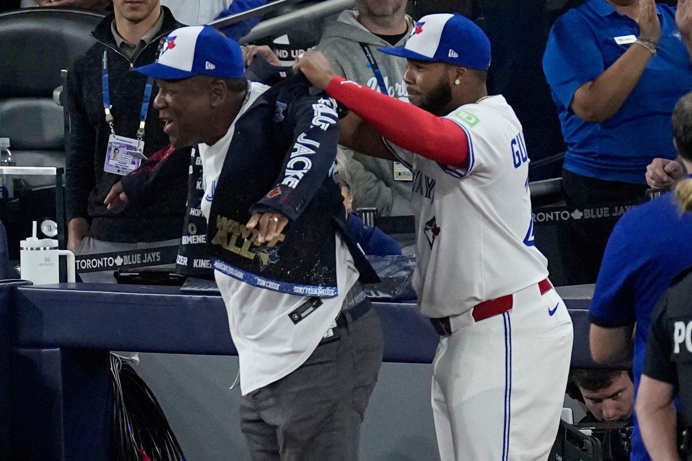 Joe Carter wears Blue Jays' home run jacket after throwing first pitch ...