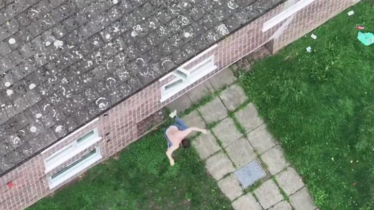 Drone footage shows shirtless burglar jump out window amid police chase