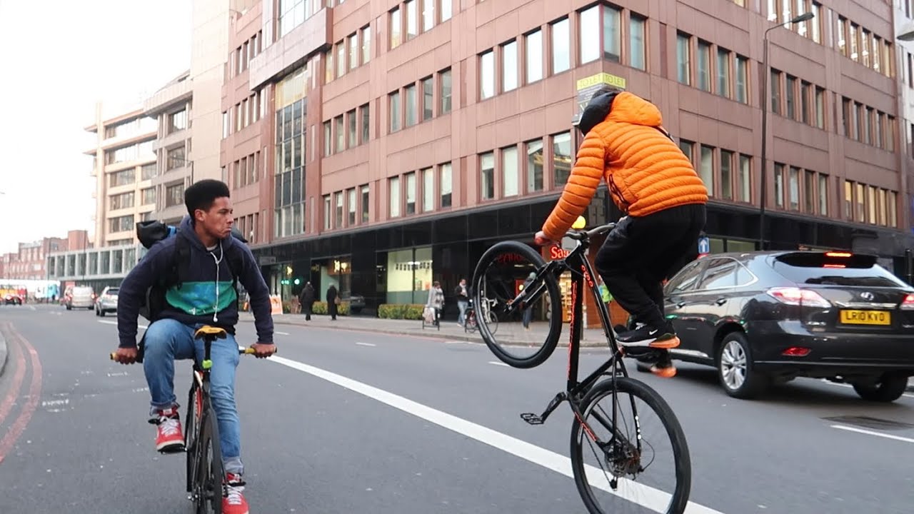 Crazy bike stunts across London city streets