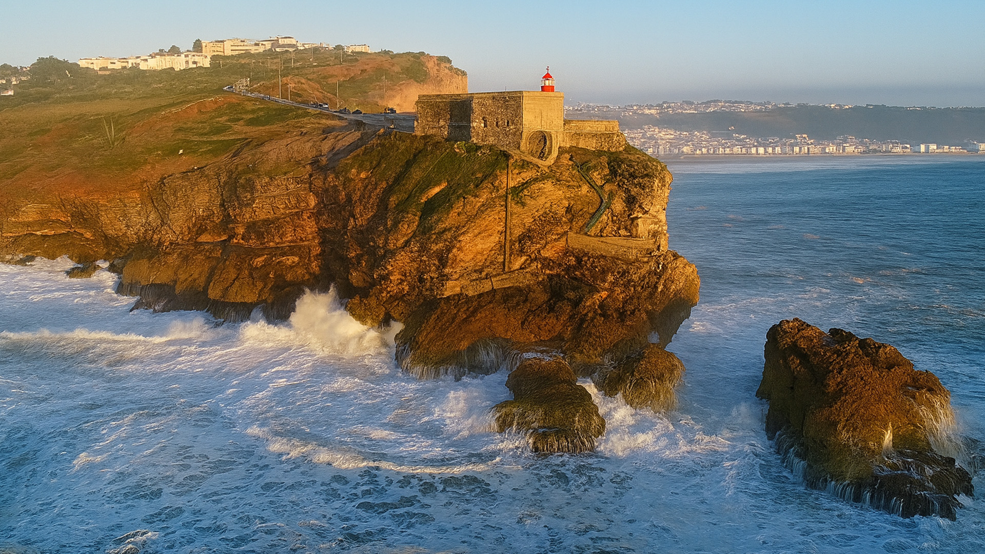 Cliffside Lighthouse at Nazaré, Portugal in 4K