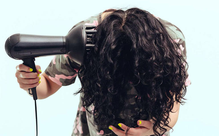 What is a hair diffuser, and how does it help curly or wavy hair?