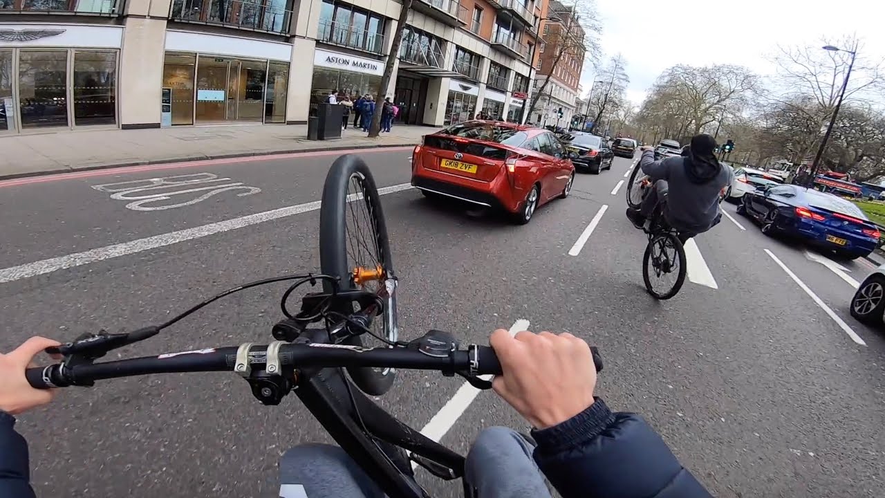Mountain bike freestyle tricks through London streets