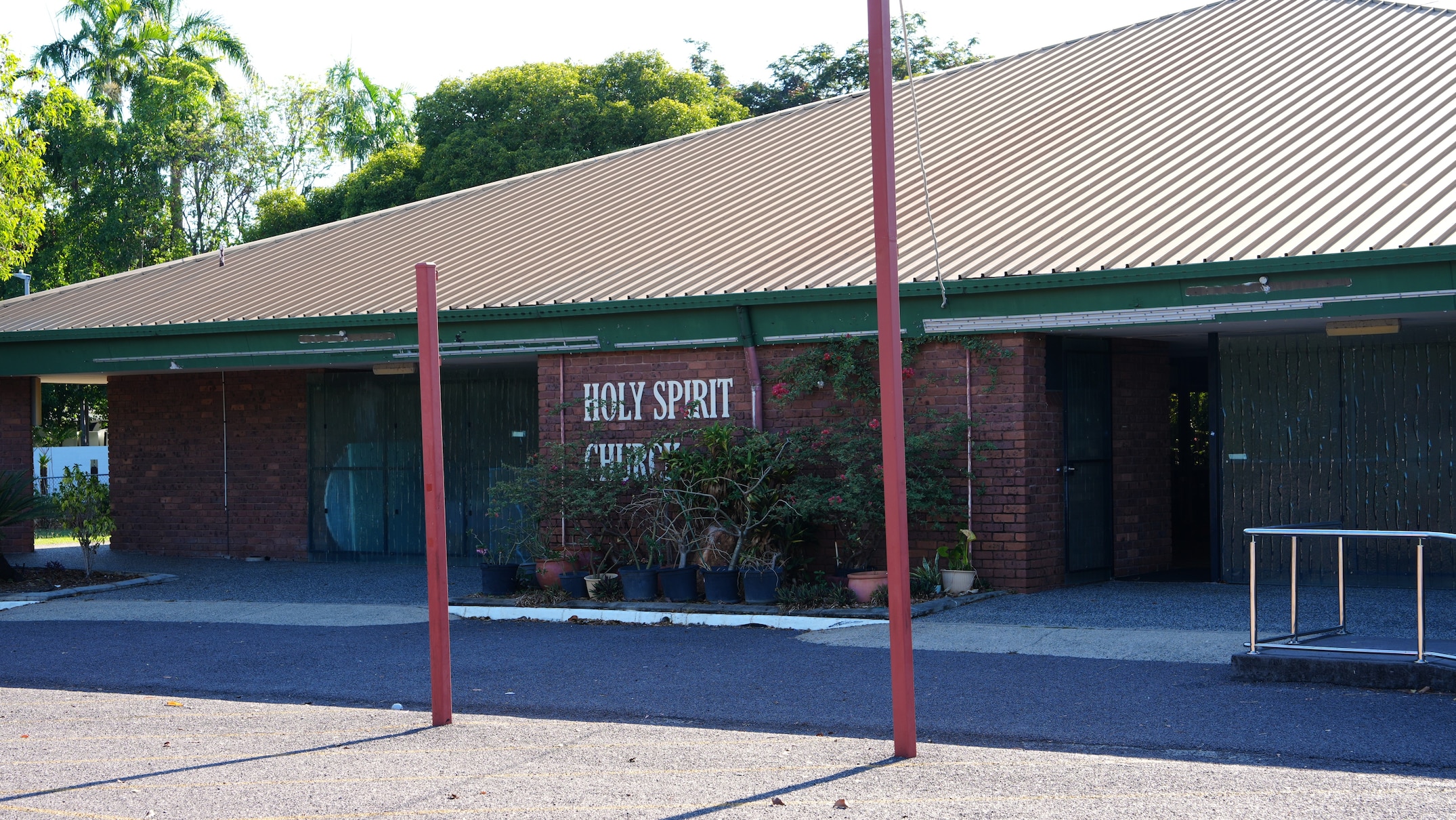 Man charged after Darwin priest stabbed in face with pen while setting ...