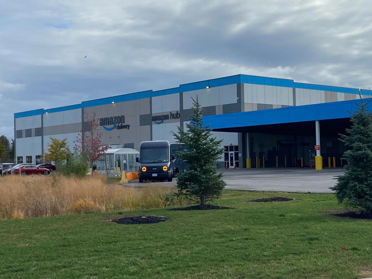 Amazon pressed to hire local workers, not add robots