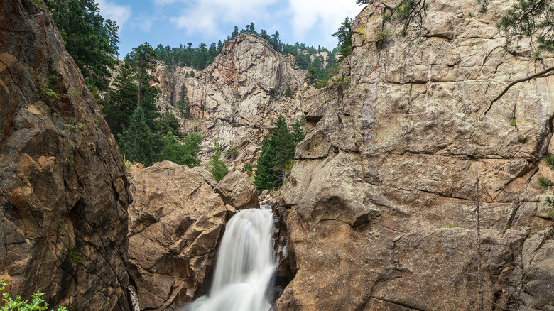 Between Denver And Fort Collins Is Colorado's Winding Canyon With Creek ...