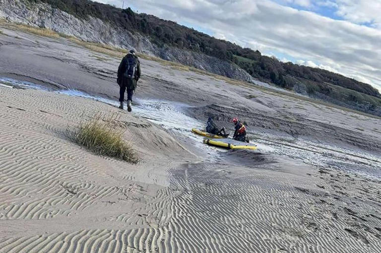 Emergency services rush to save man trapped in quicksand with ‘only ...