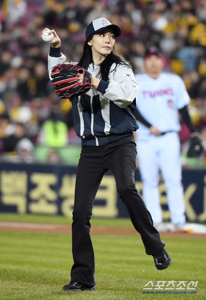 Actor Soyeon Kim pitches the second game of the Korean Series.