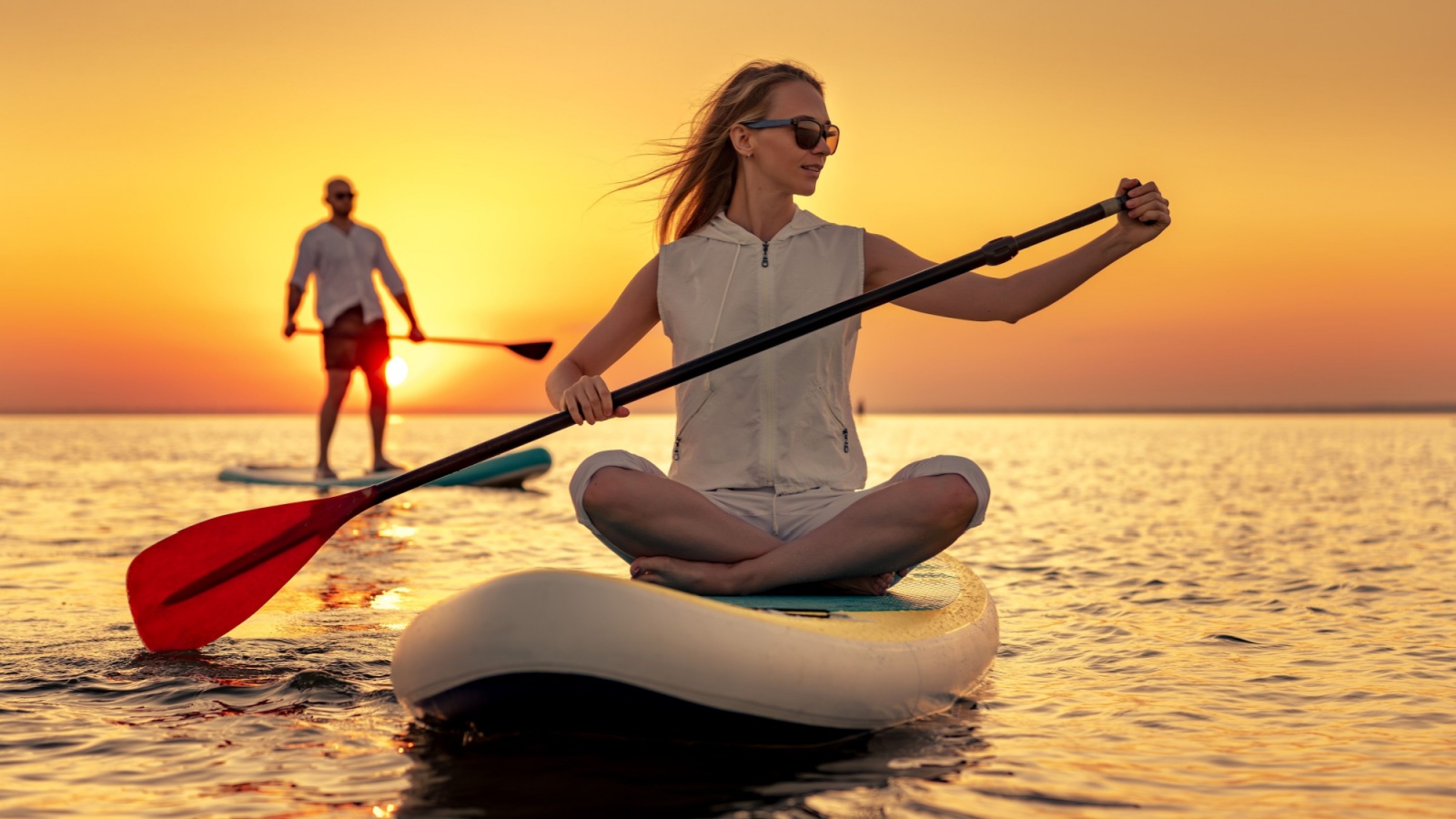 Sunset paddleboard tours on mirrored lakes