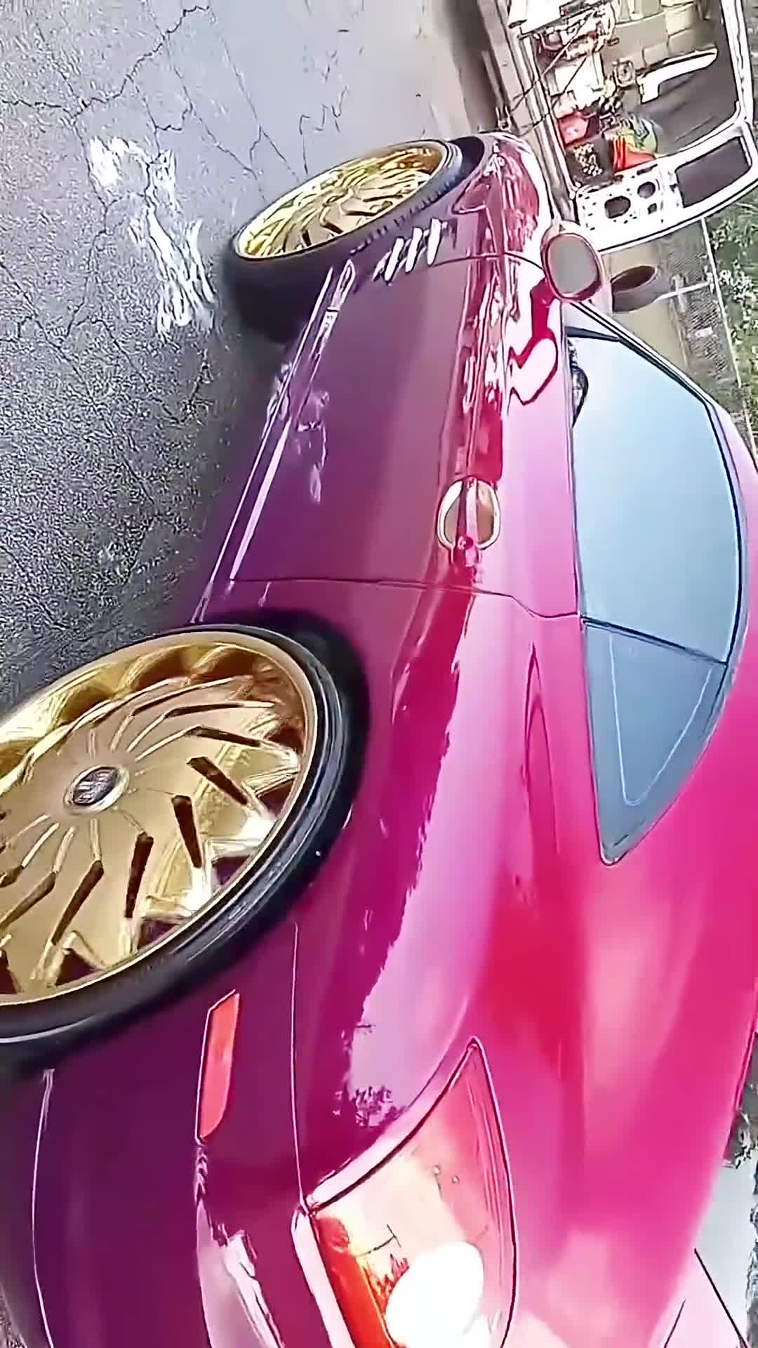 Candy magenta pink Chrysler Crossfire on gold 26" DUB floaters