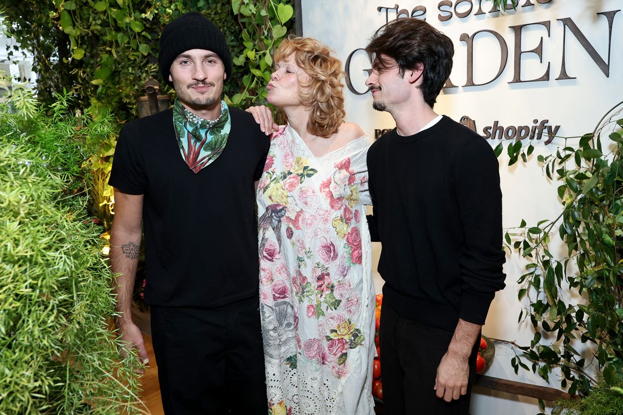 Pamela Anderson teams a white button-down with piles of diamonds and an ...