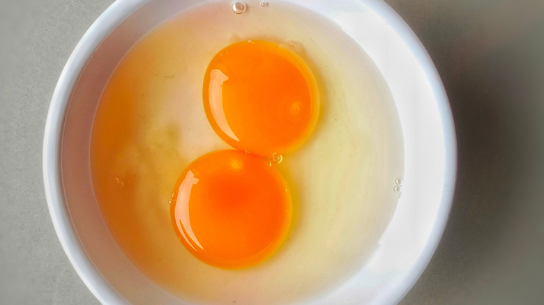 Here's Why There Are Red Spots In Your Egg Yolks