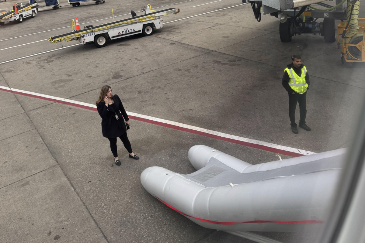 Delta flight attendant pops emergency slide before takeoff in $100,000 ...