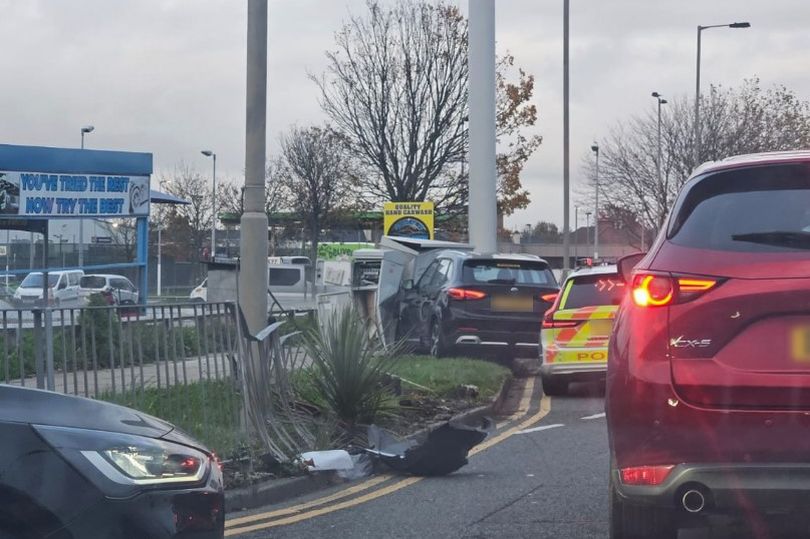 Car crashes through railings near Asda
