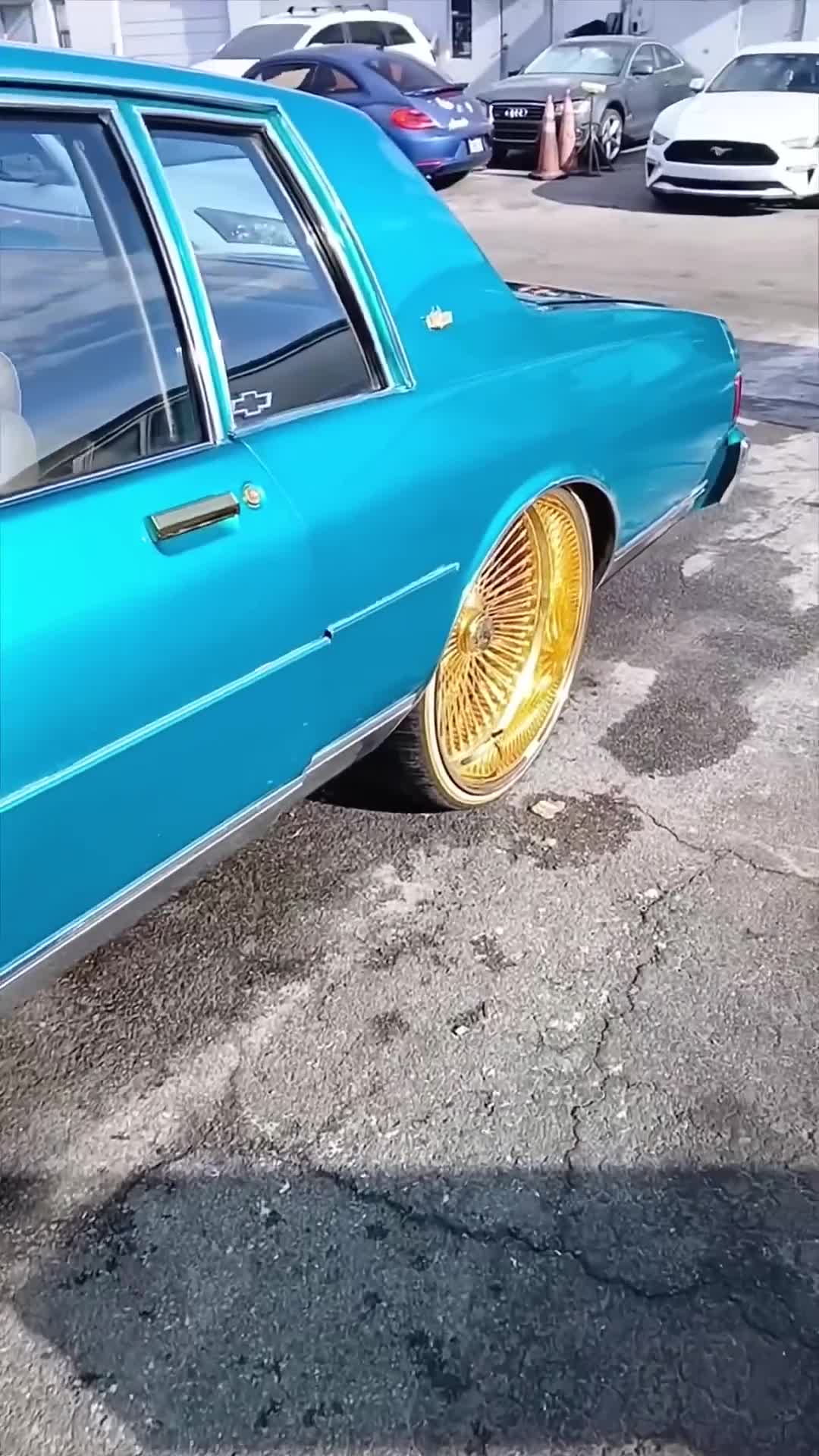 Candy Teal 2-Door Chevy Box on Gold 24’s Daytons