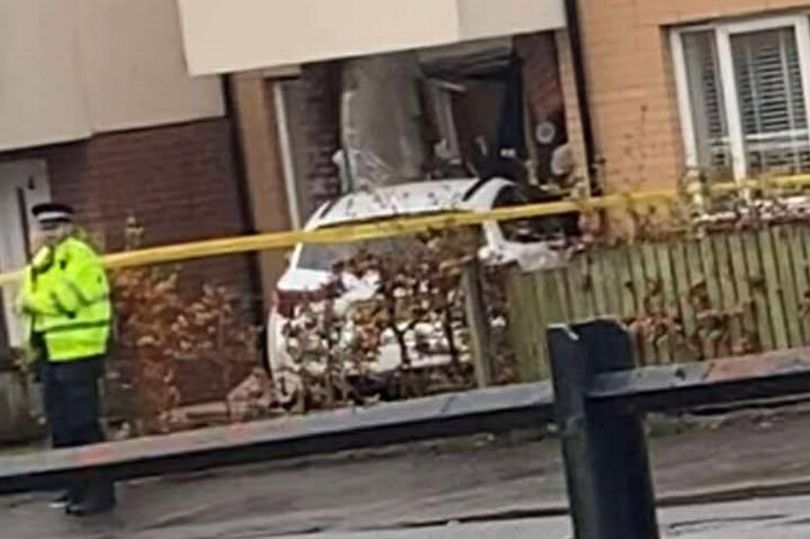 Police rush to Bishopbriggs street after car crashes into house