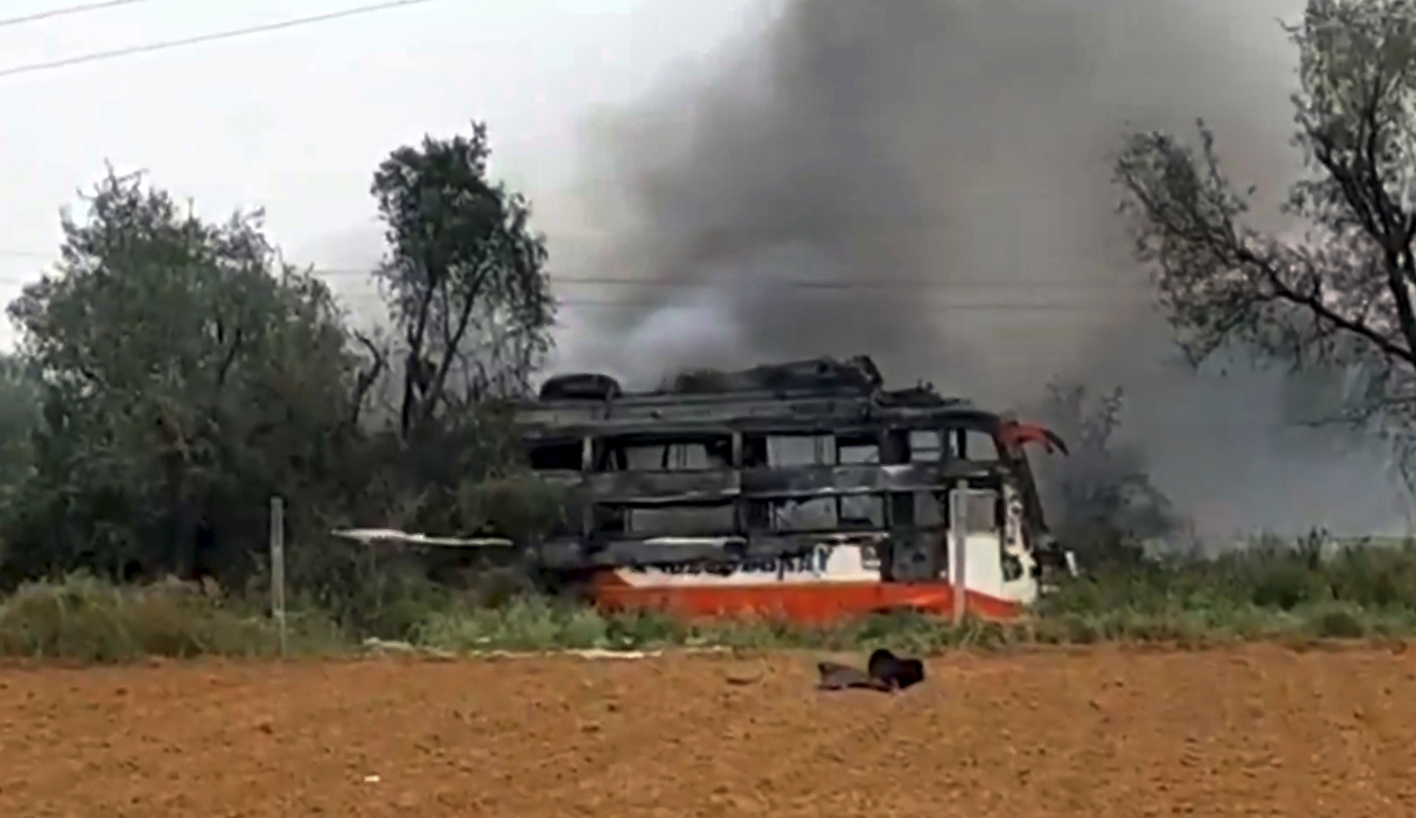 Two killed as bus catches fire after coming in contact with power line ...