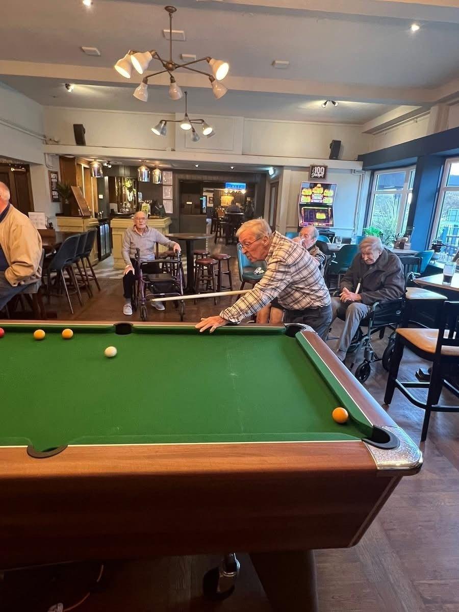 Residents from Shoreham care home enjoy a gentlemen’s pub outing