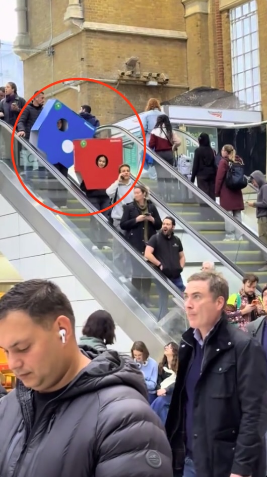 Giant Domino's pizza boxes spotted riding escalators during rush hour ...