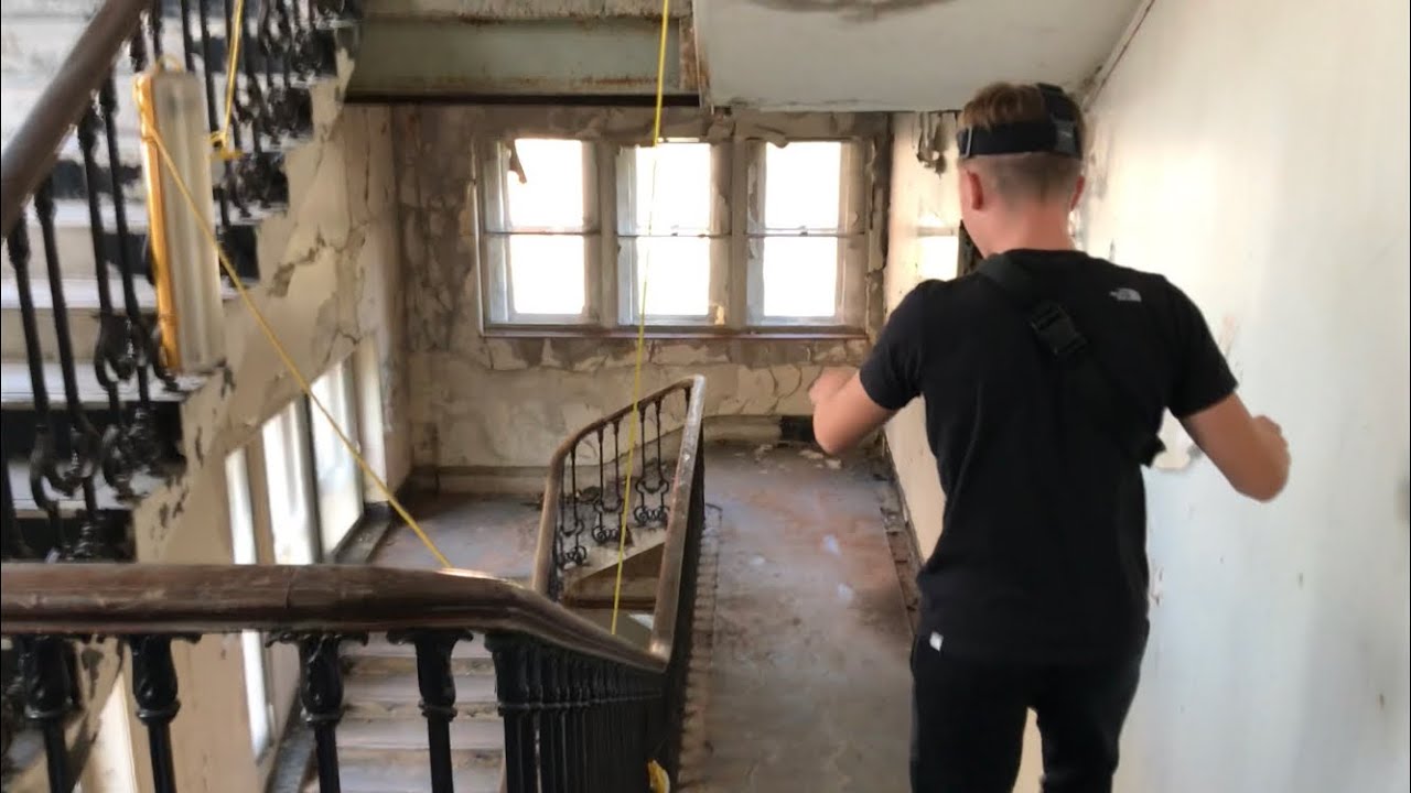 Explorers investigate reportedly haunted abandoned hospital building