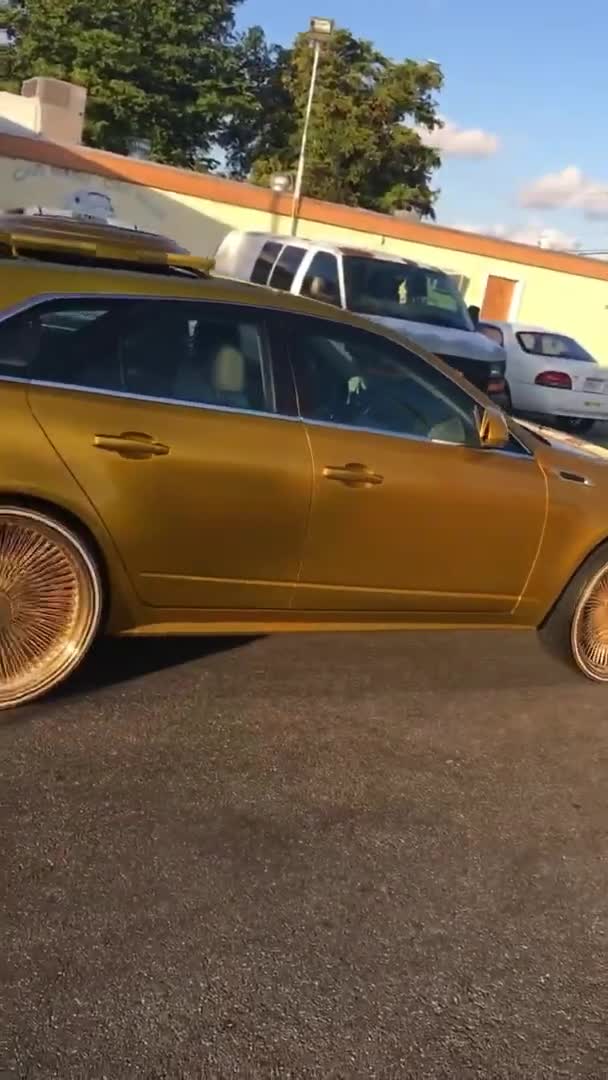 Candy gold CTS wagon on gold 24” Daytons w/Vogue tires