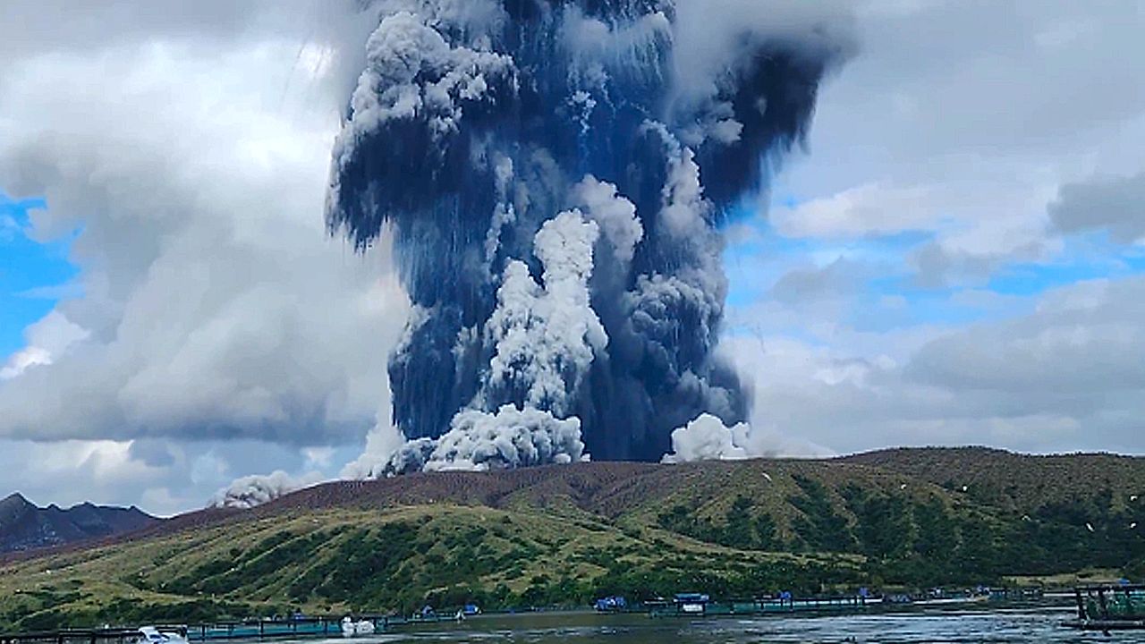 Terrifying moment panicked fishermen flee from erupting volcano