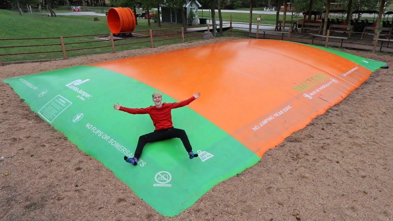 Watch what happens when friends brave a giant slippery trampoline in ...