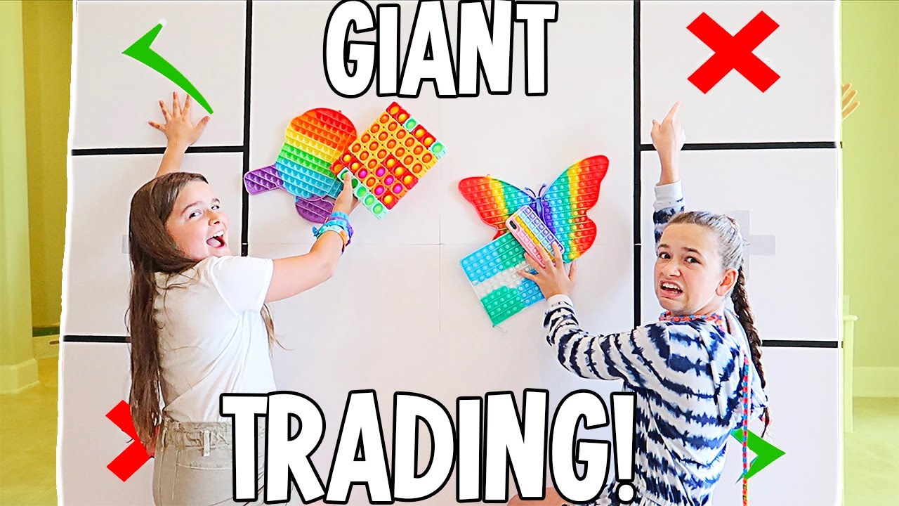 Trading fidget toys on a giant board! Who will win? | JKREW