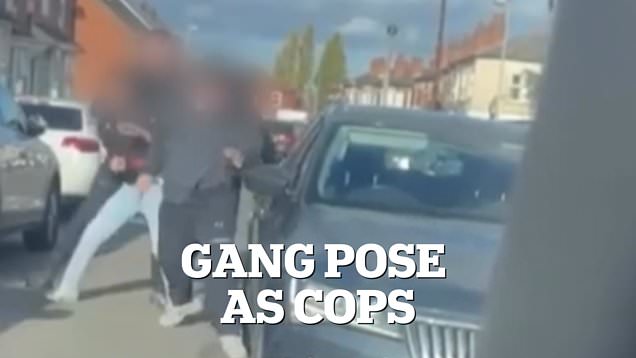 Moment gang posing as officers rob man for his watch before fleeing