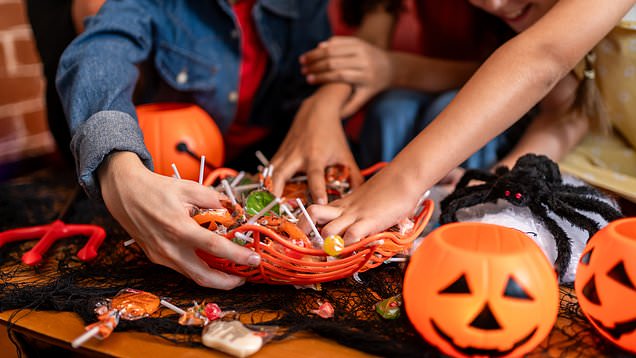 Dad gets caught being greedy with trick-or-treat candy