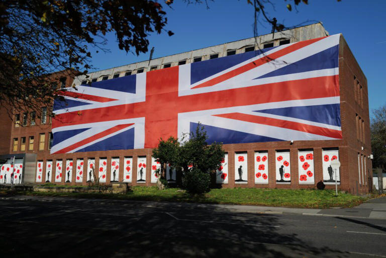 Property developer drapes huge Union Jack flag on old council HQ