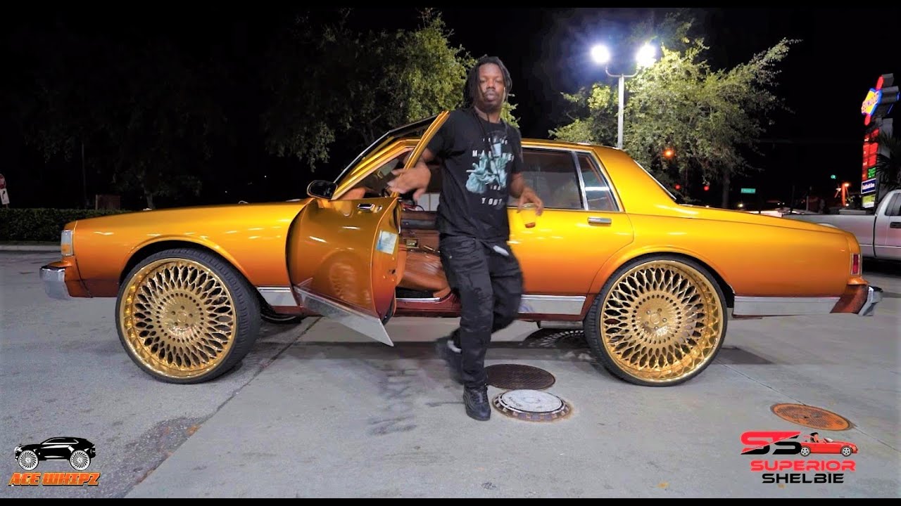 Little Haiti yank's candy gold Chevy box on gold 28" Savini wheels