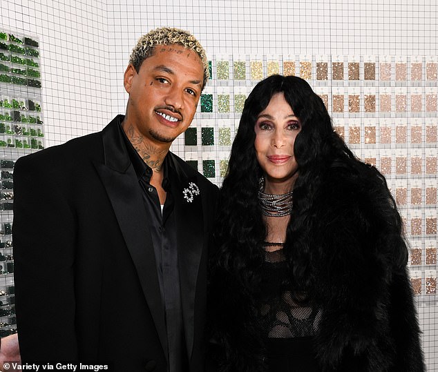 Cher, 79, and toyboy Alexander 'AE' Edwards, 39, hold hands on red carpet