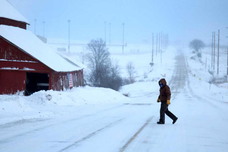 When does central Iowa typically see its first snowfall?