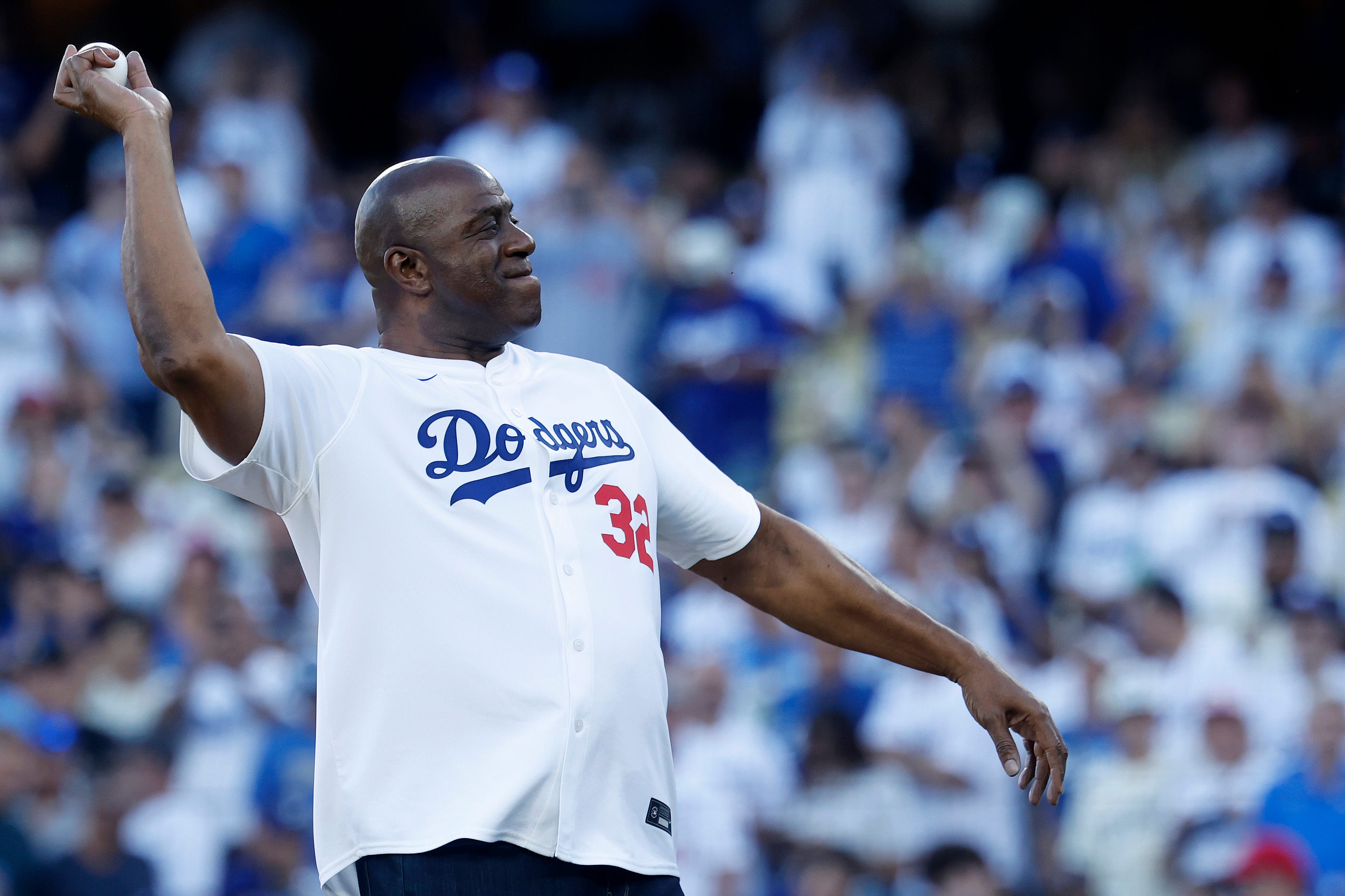 NBA legend Magic Johnson throws out first pitch at World Series Game 5