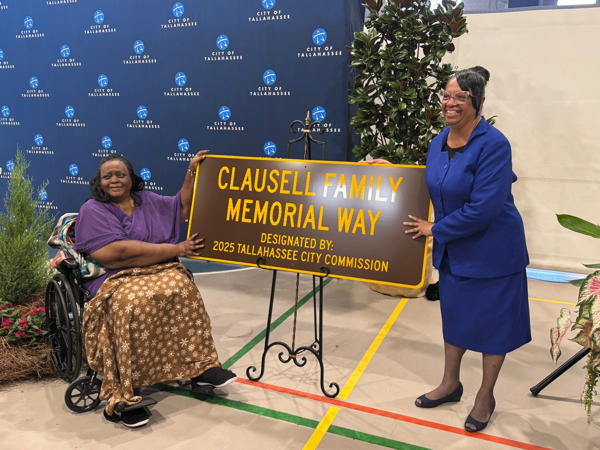 Daughters unveil street sign for beloved Clausell parents