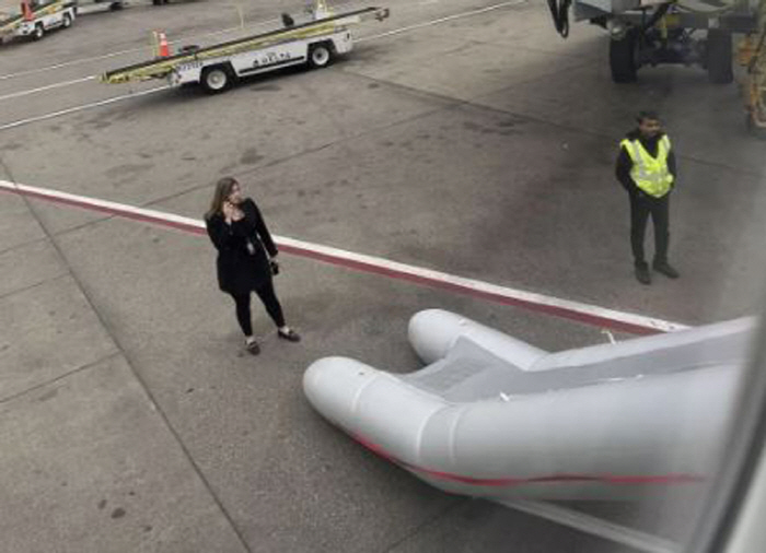 Flight attendant flight emergency slide malfunction mistake with 26 ...
