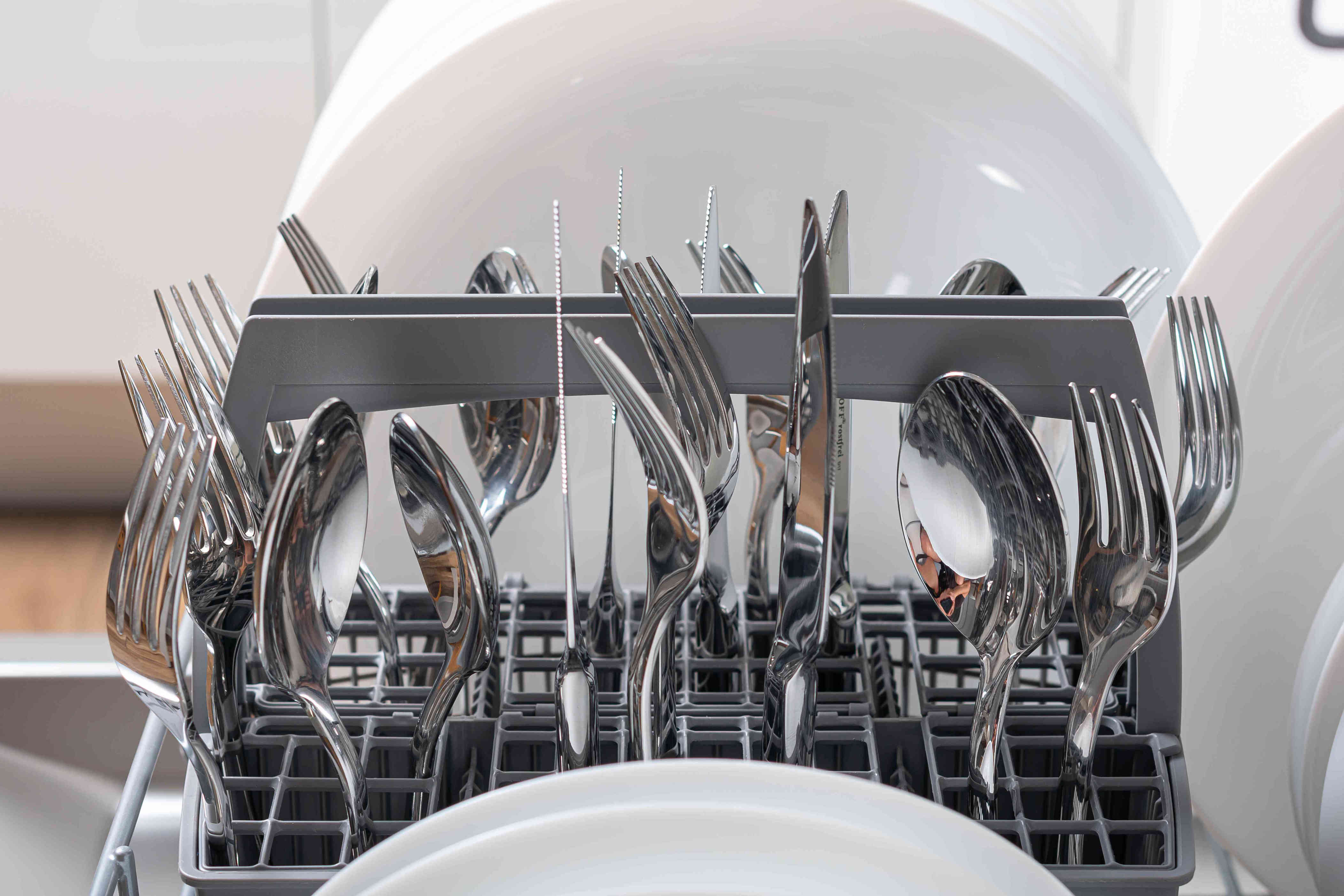 Should You Load Silverware in the Dishwasher Facing Up or Down?