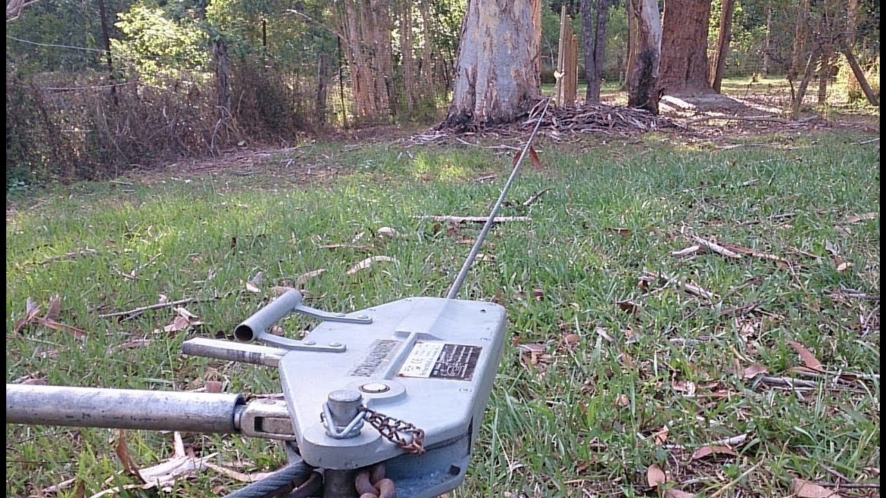 Pull a fence tight with a hand winch