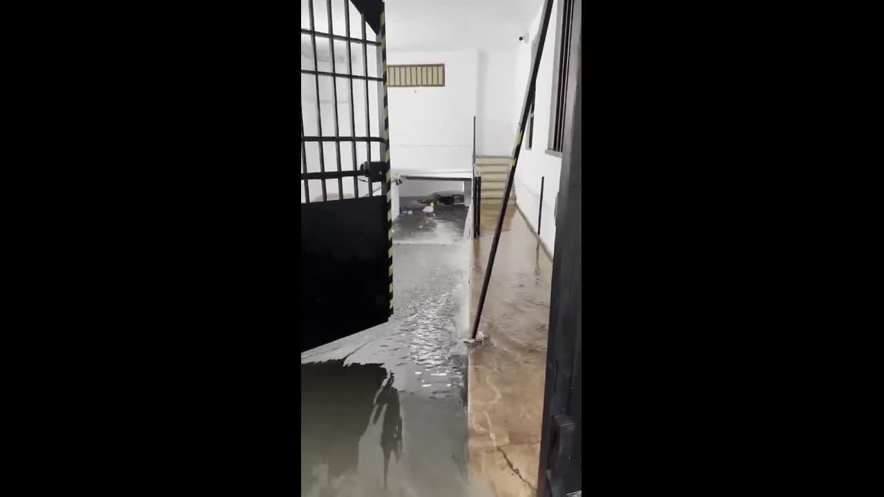 Bus and cars stranded amid heavy flooding in Seville, Spain