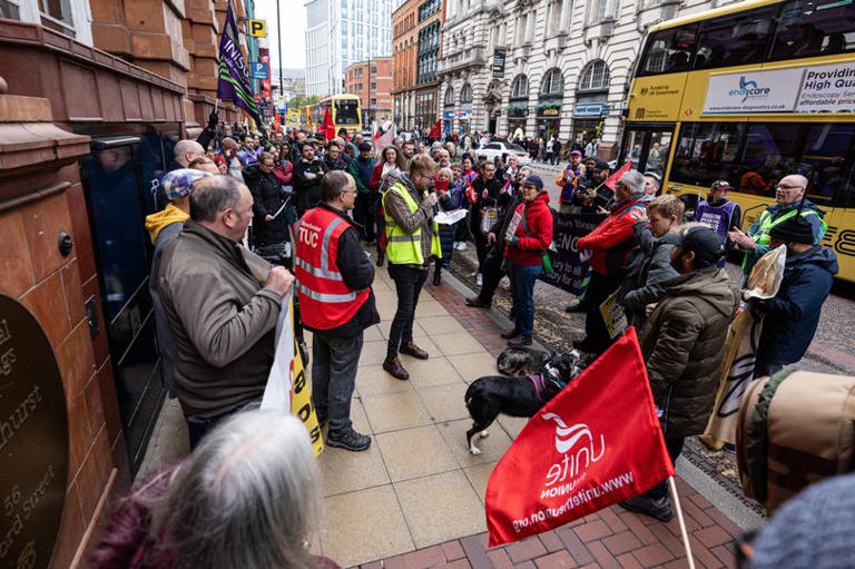 Striking TfGM staff stop traffic in Manchester city centre in ongoing ...
