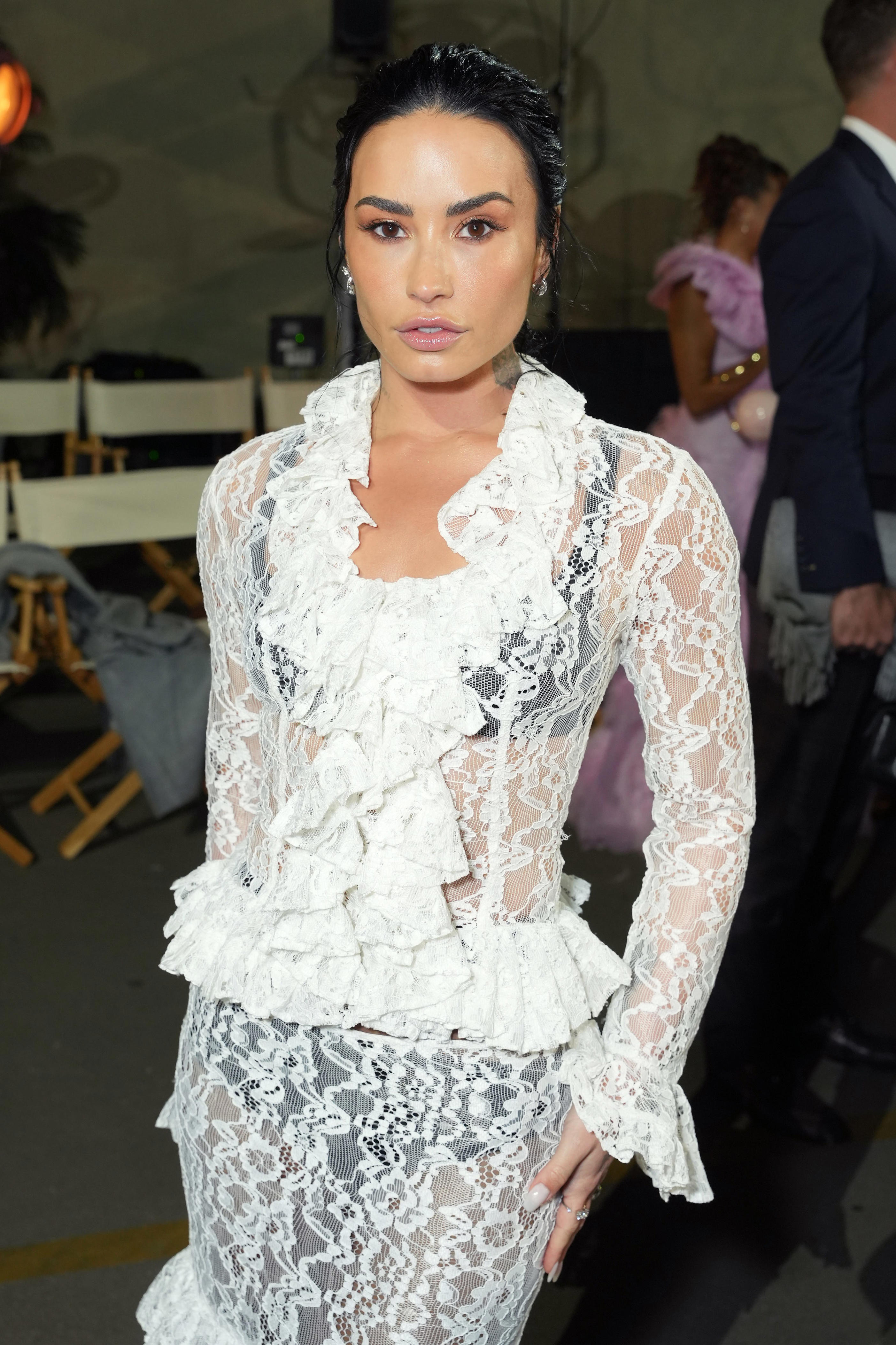 Demi Lovato lets viral alter ego Poot 'out of the basement' for campy ...