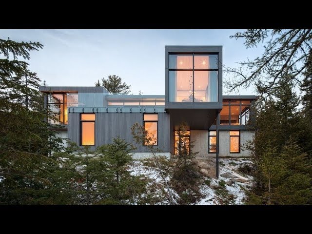 A house perched on a steep slope captures the beauty of the rivière