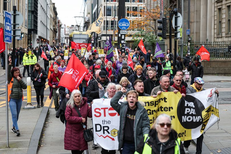 Striking TfGM staff stop traffic in Manchester city centre in ongoing ...