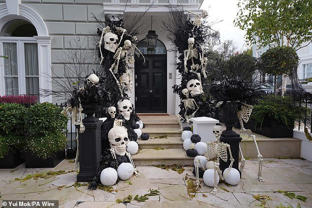 Halloween havoc: Skeletons, coffins and ghouls decorate some of London ...